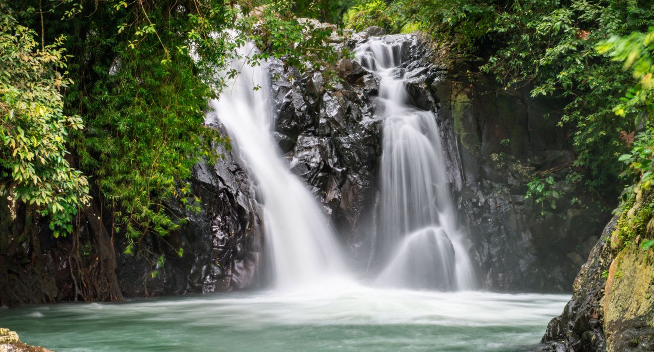 These Secret Bali Waterfalls Boast A Natural Slide & Are Instagram-Perfect