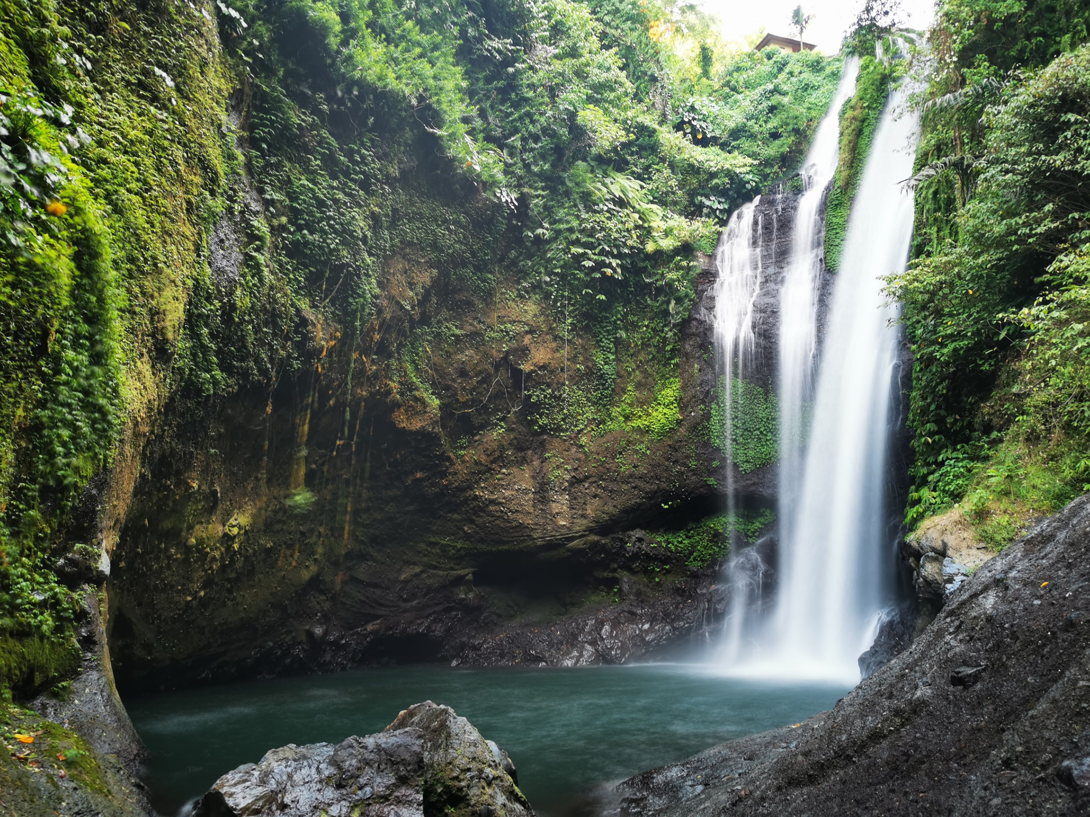 These Secret Bali Waterfalls Boast A Natural Slide & Are Instagram-Perfect