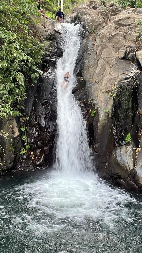 These Secret Bali Waterfalls Boast A Natural Slide & Are Instagram-Perfect